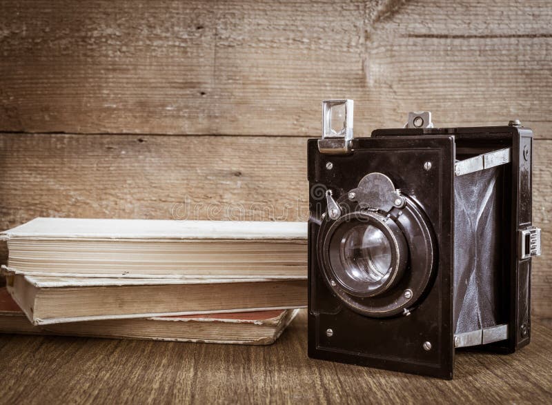 Old camera with books stock photo. Image of stack, retro - 67405136