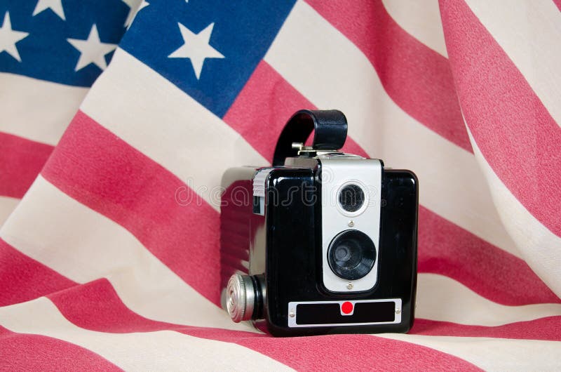 Old camera on flag stock photo. Image of camera, retro - 42032198