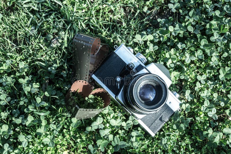Old camera on grass stock photo. Image of lens, black - 68232786