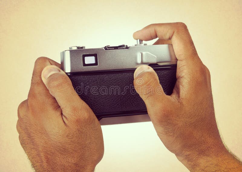 Old camera in hand stock photo. Image of snapshot, color - 32229710