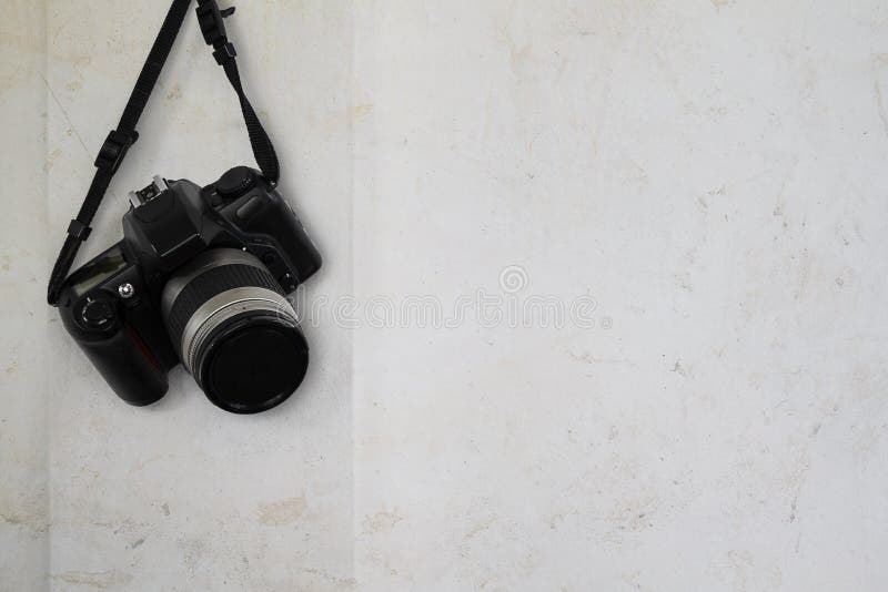 Old Camera Hanging on White Grunge Vintage Wall Background Stock Image ...