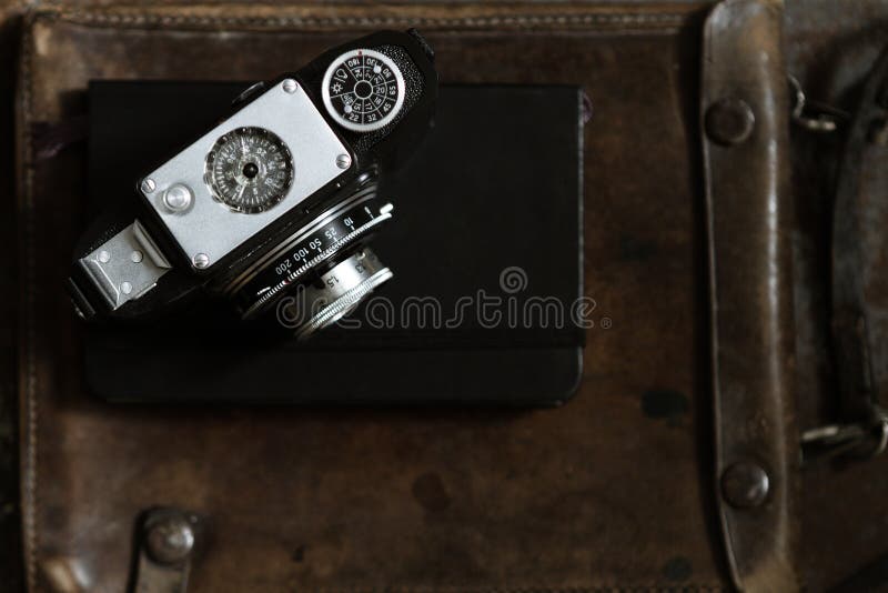 Old Camera Laying on the Leather Tablet, Top View Stock Photo - Image ...