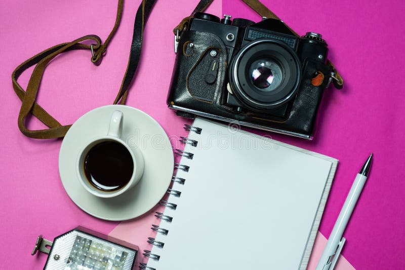 An Old Camera, a Notebook and Coffee. Top View of the Business Table. a ...