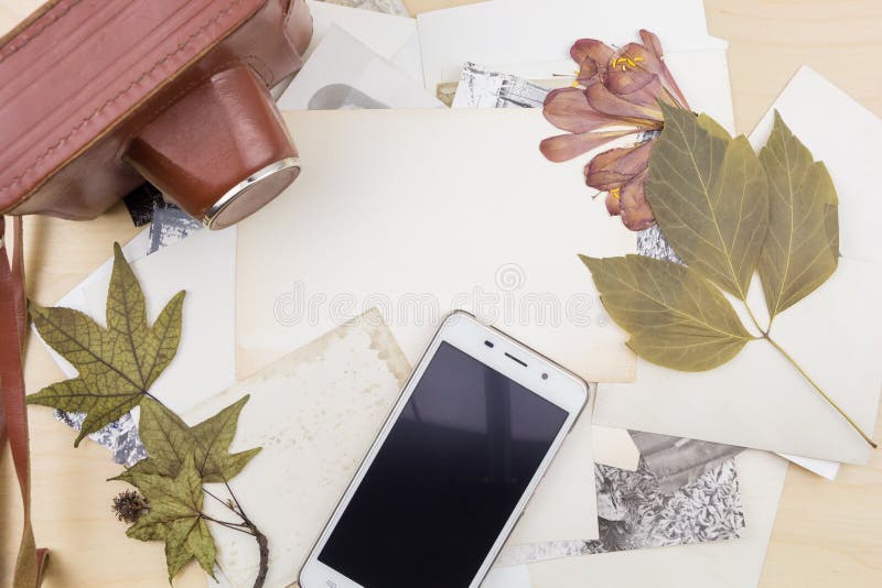 Old Camera and Smartphone on Stack of Photos Stock Image - Image of ...