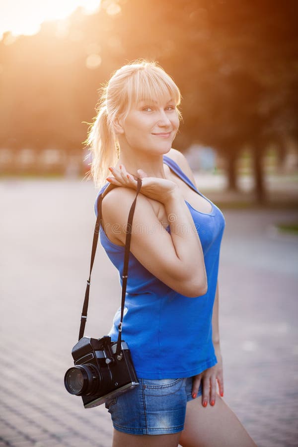 Old camera on a strap stock photo. Image of legs, french - 59472662