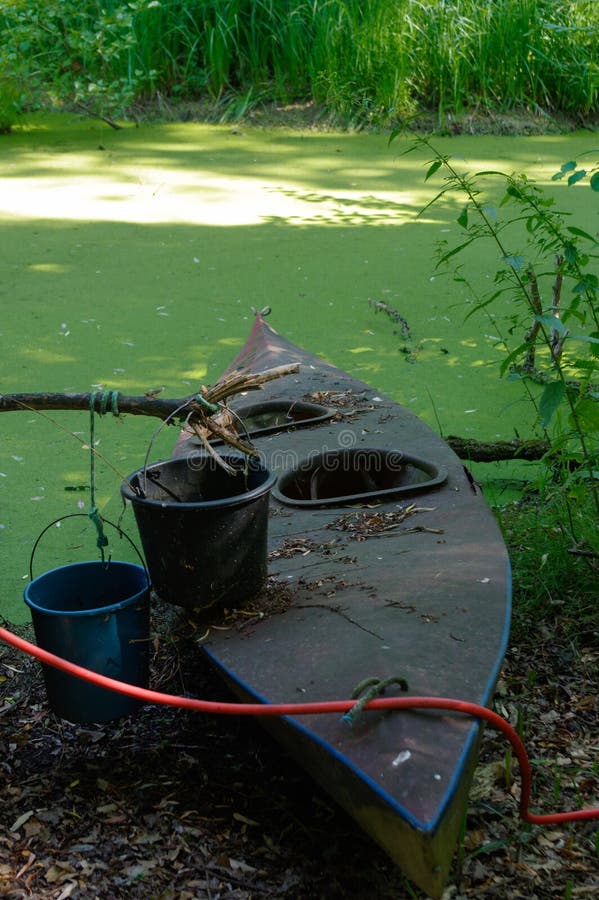 Old Canoe Ashore the Pond with Bucket on it Stock Image - Image of ...