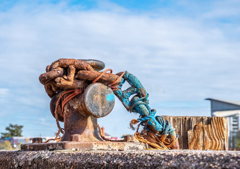 An Old Capstan with a Rusty Metal Chain Around it, Part of the ...
