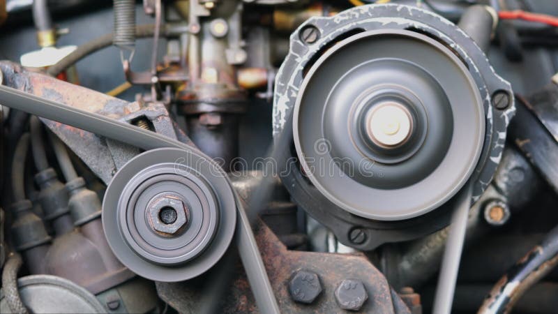 Movement of Metal Wheel and Belt in a Mechanical Device. Gearbox Stock ...