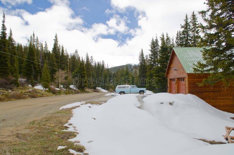 House during a Snow Storm Cars in Driveway Stock Photo - Image of cars ...