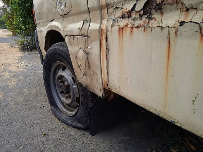 The Body of an Old, Rusty Car Sat on the Side of the Road. Stock Photo ...