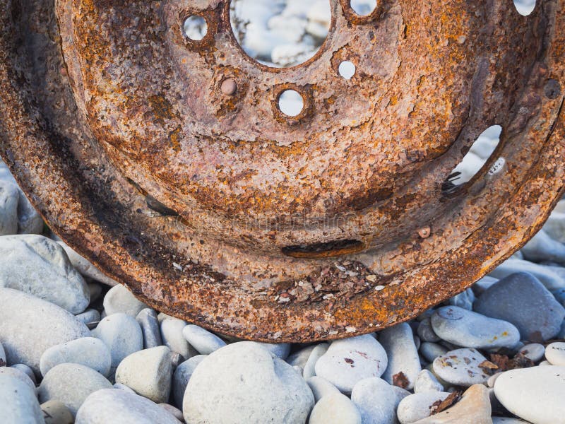 Old Car Wheel, Rusty Car Alloy Rim on Stones by the River Stock Photo ...