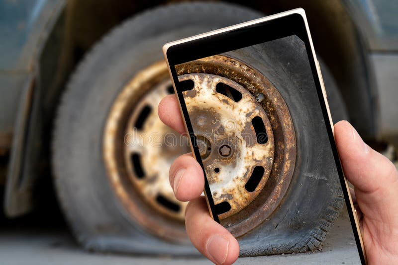 Old Car Wheel on Smartphone Screen. Stock Photo - Image of deflated ...