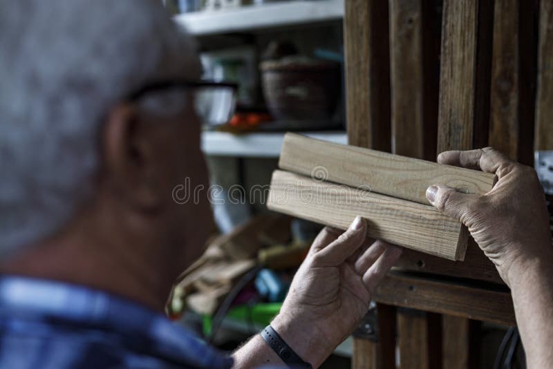 Old Carpenter Checking the Wood Planks Stock Photo - Image of looking ...