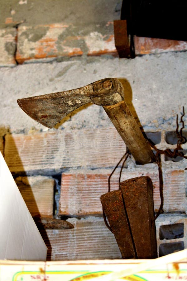 Old Carpenter`s Ax Inserted in an Exposed Brick Wall Stock Image ...