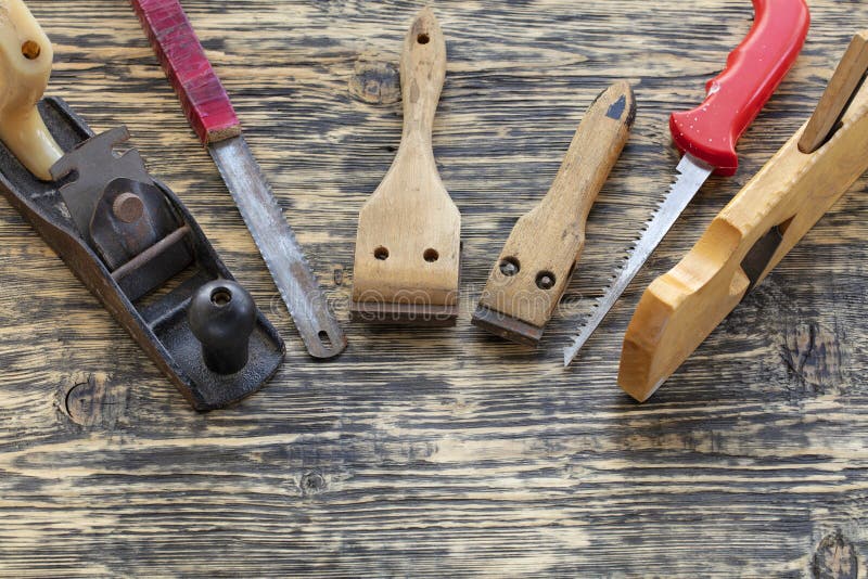 Old Carpentry Tools Lie on a Wooden Table Stock Photo - Image of ...