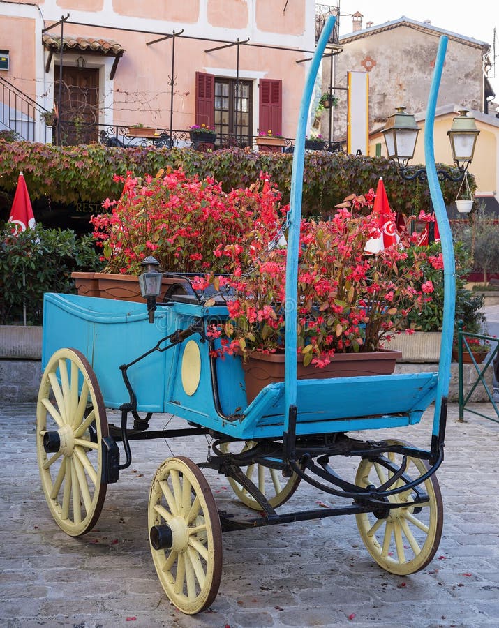 The Old Carriage Decorated with Flowers on the Street Stock Image ...