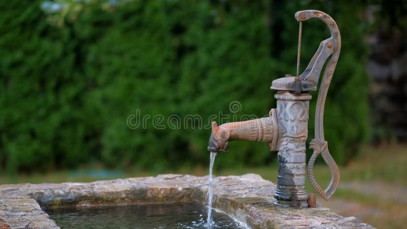 An Old Cast Iron Hand Pump Water Column is Equipped for a Decorative ...