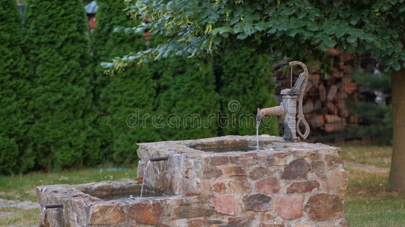 An Old Cast Iron Hand Pump Water Column is Equipped for a Decorative ...