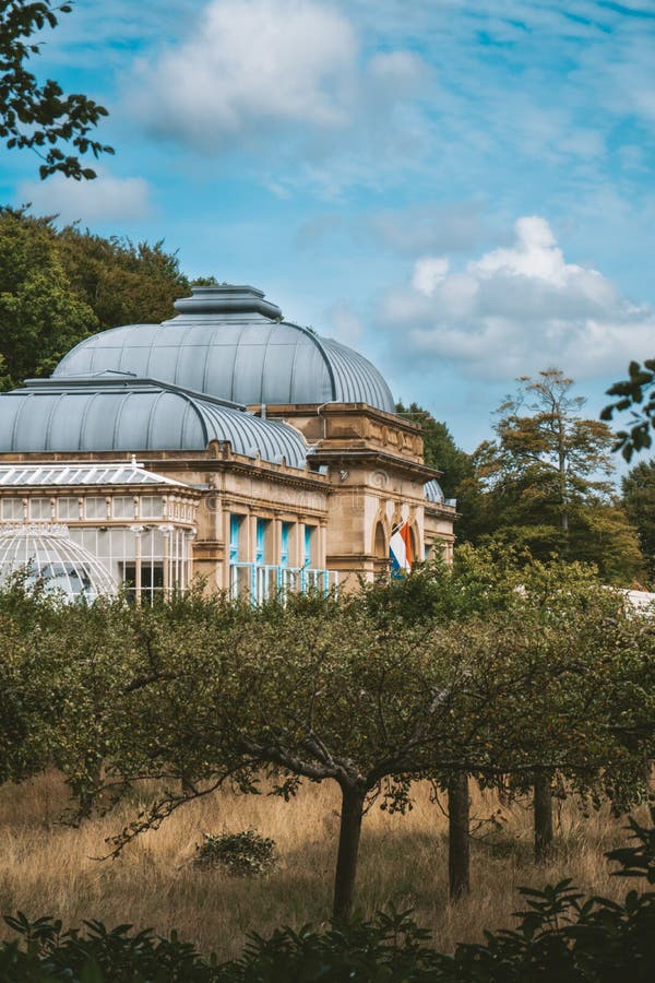 Old Castle Surrounded by Trees with a Cloudy Sky Above Stock Image ...