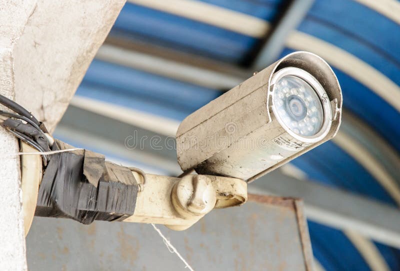 Security CCTV Camera on Glass Facade Stock Photo - Image of blue, lens ...
