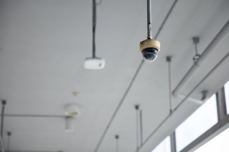 Old CCTV camera on ceiling stock photo. Image of outdoor - 140992190