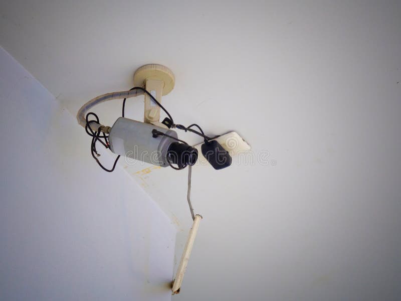 Security Cameras On Building Roof Stock Photo - Image of zoom, plain ...