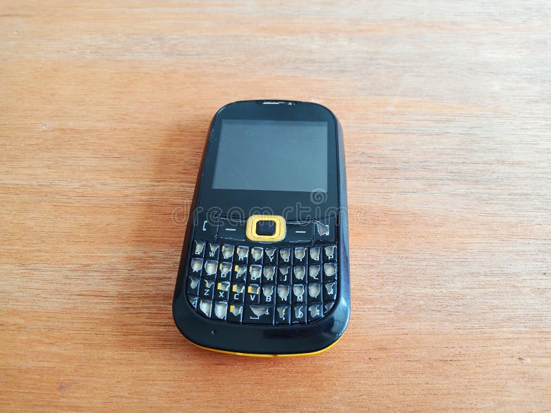 An Old Cell Phone with a Chipped Keypad. Stock Photo - Image of calling ...