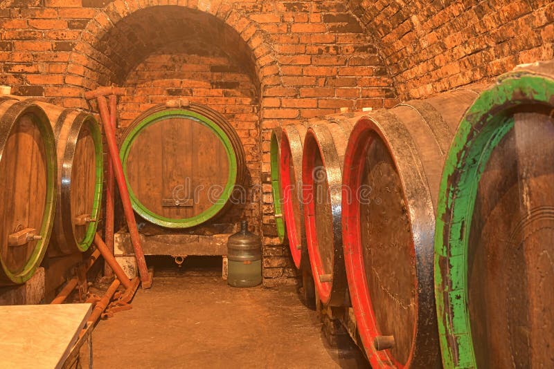 Old Cellar with Bottles and Barrels Under Castle Making Wine Stock ...