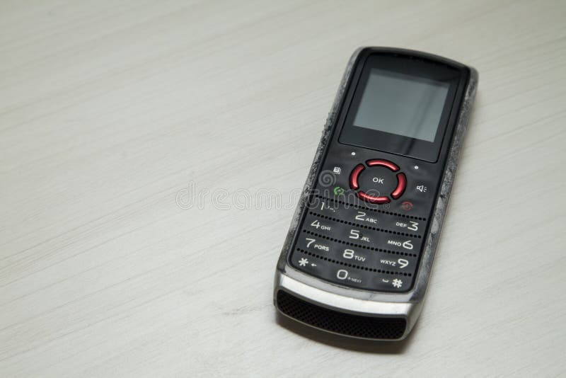 Old Cellular Device Placed on the Table Top in the Home Office Stock ...