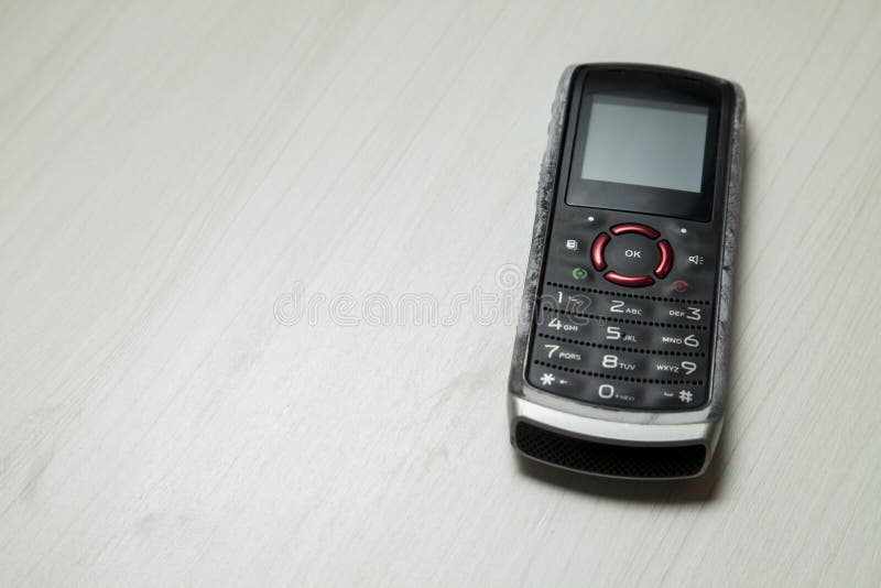 Old Cellular Device Placed on the Table Top in the Home Office Stock ...