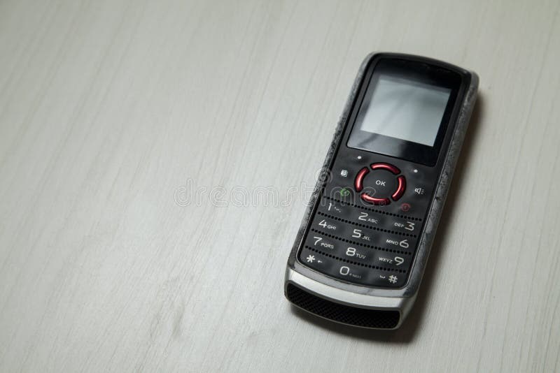 Old Cellular Device Placed on the Table Top in the Home Office Stock ...
