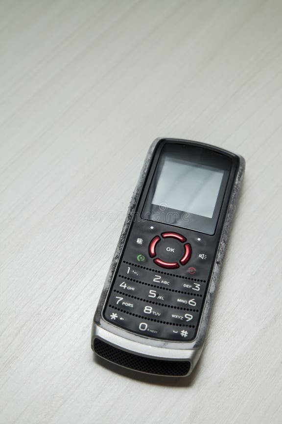 Old Cellular Device Placed on the Table Top in the Home Office Stock ...