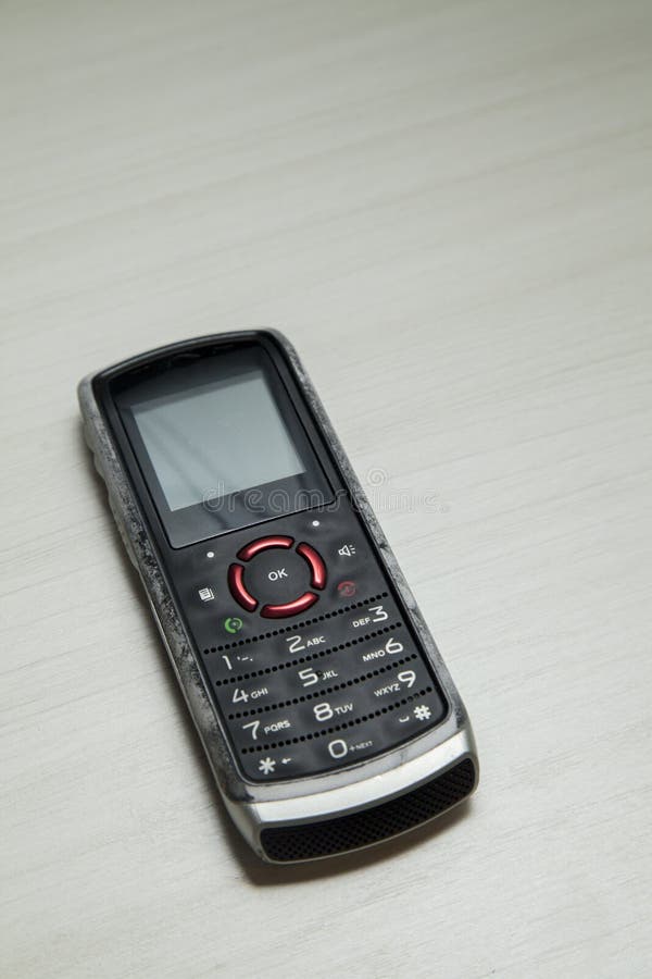 Old Cellular Device Placed on the Table Top in the Home Office Stock ...