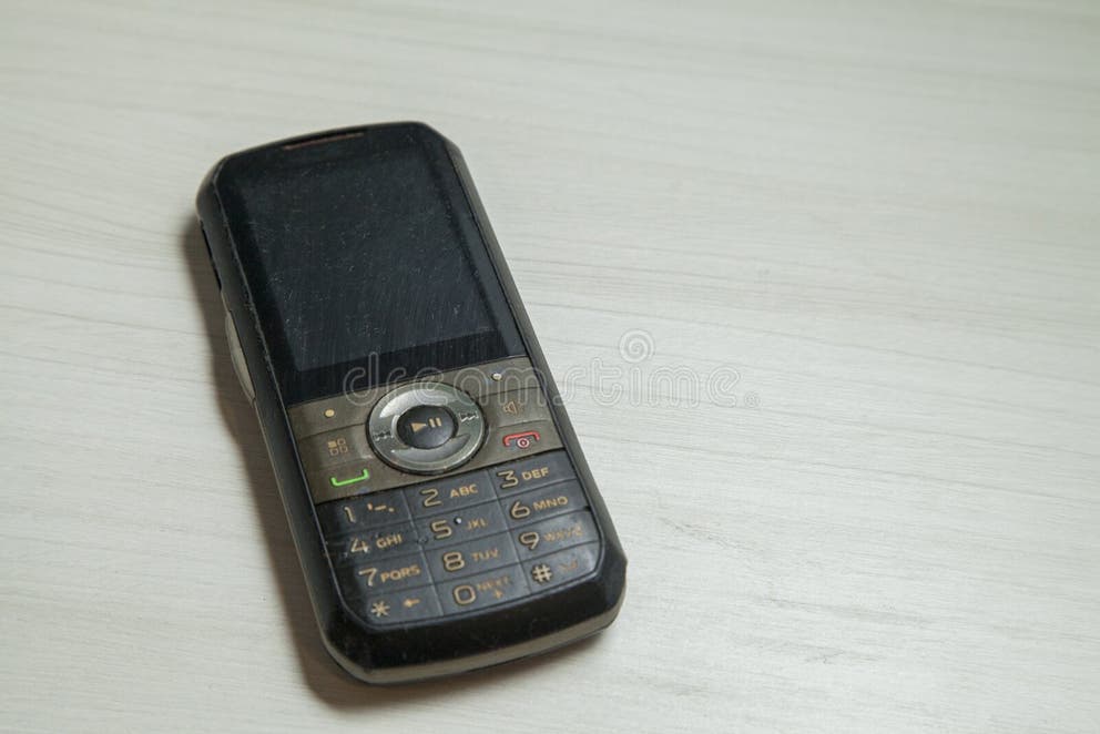 Old Cellular Device Placed on the Table Top in the Home Office Stock ...