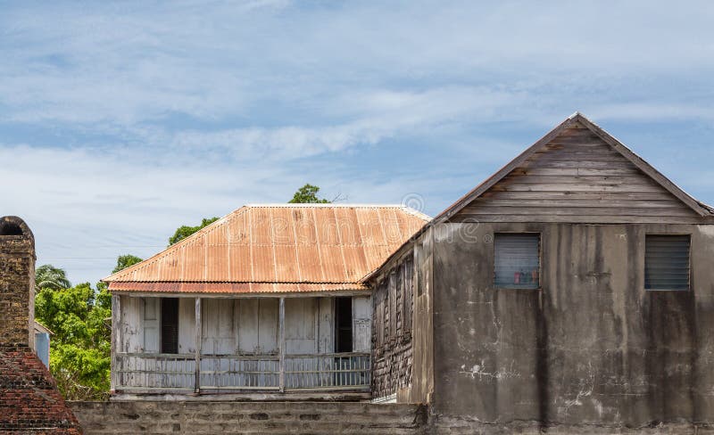 Old Cement Building with Tin Roof Stock Image - Image of blue, metal ...