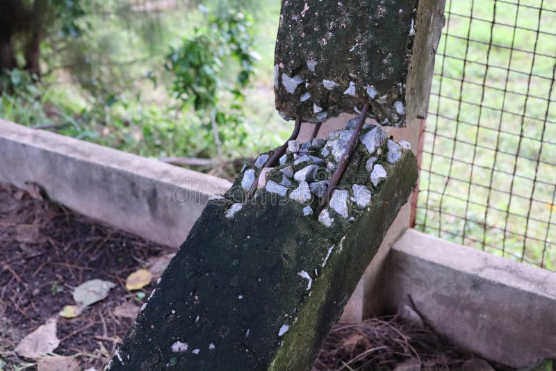 Old Cement Columns with Cracks. Rusty Iron Visible Inside Stock Image ...