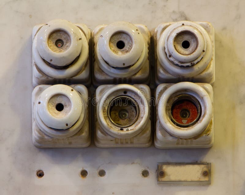 The Old Ceramic Fuses on a Wall Stock Photo - Image of wall, yellow ...