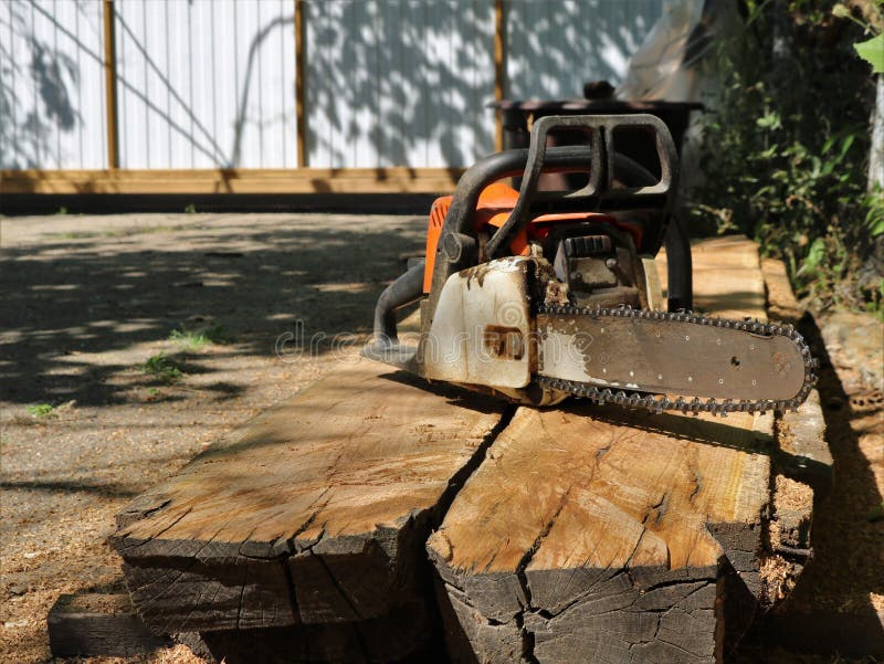 Vintage Chainsaw in Countryside Yard Stock Photo - Image of hand, metal ...