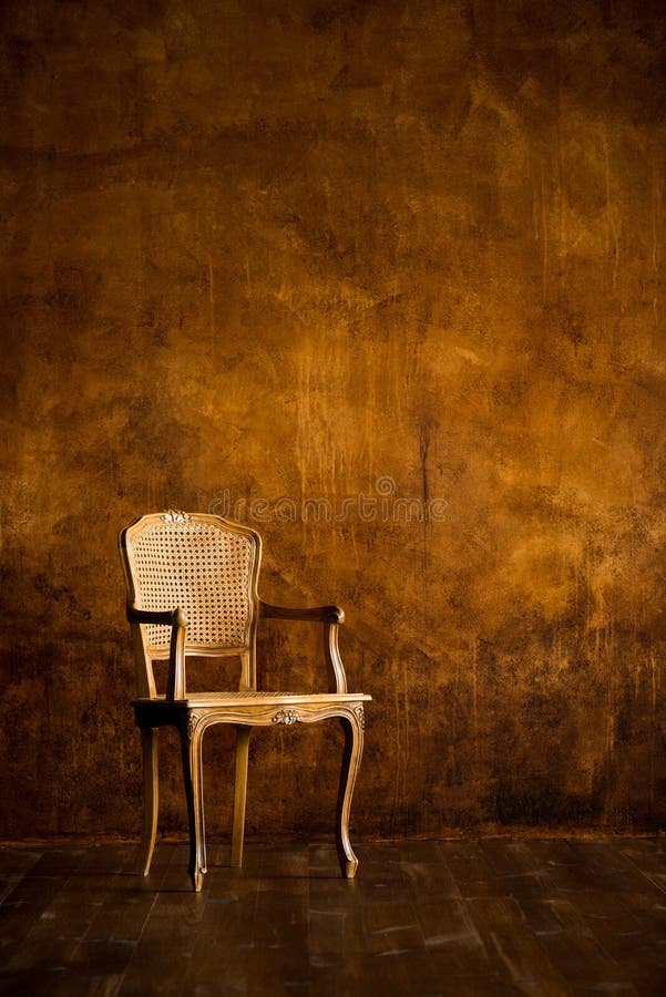 Old Chair on a Brown Wall Background. Stock Image - Image of chair ...