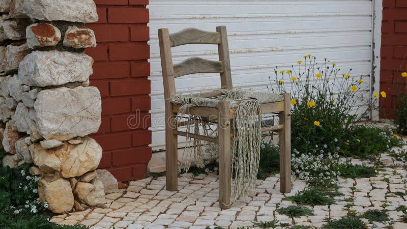 Old Chair in Front of a Building Stock Photo - Image of chair, stone ...
