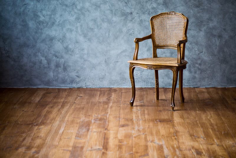 Old Chair on a Gray Wall Background. Stock Photo - Image of elegance ...