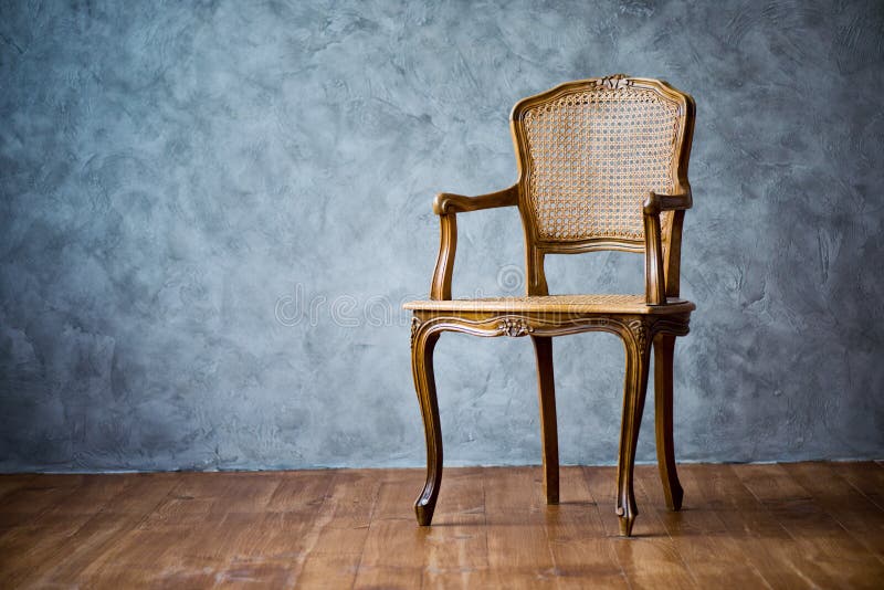 Old Chair On A Gray Wall Background. Stock Photo - Image of concrete ...