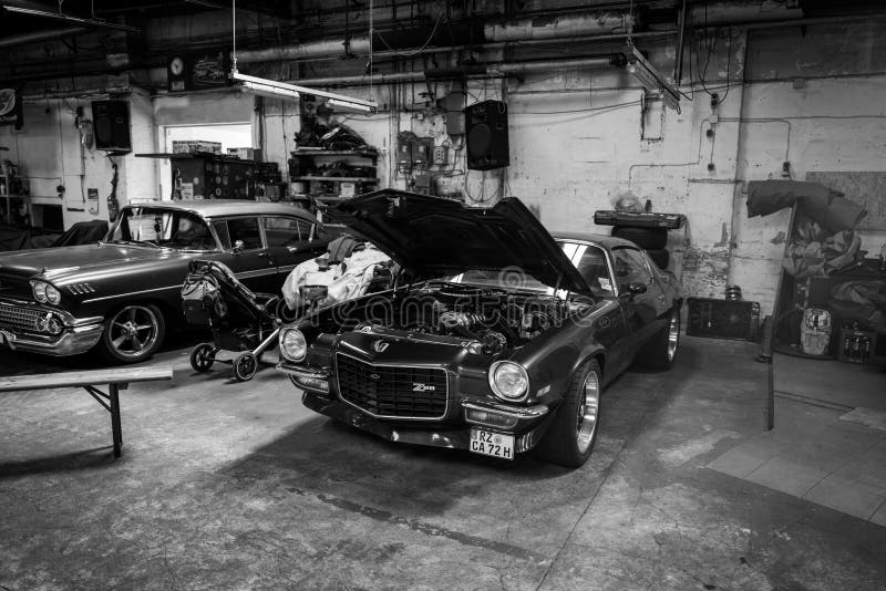 An Old Cheverolet with Open Engine Hood Stands in a Workshop Editorial ...
