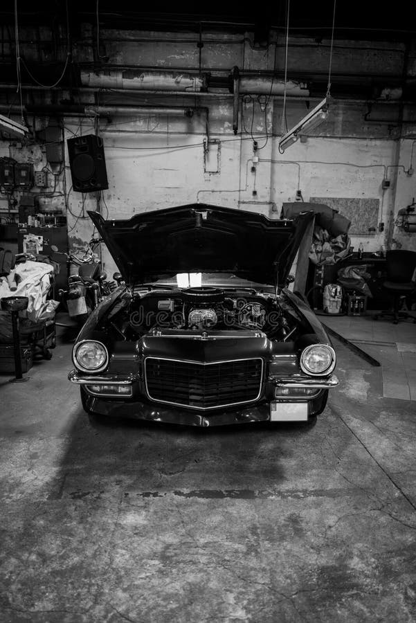 An Old Cheverolet with Open Engine Hood Stands in a Workshop Editorial ...
