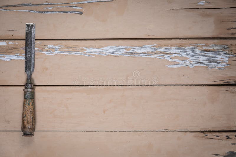 Old Chisel with Wooden Handle Positioned on the Left Edge of a Beige ...