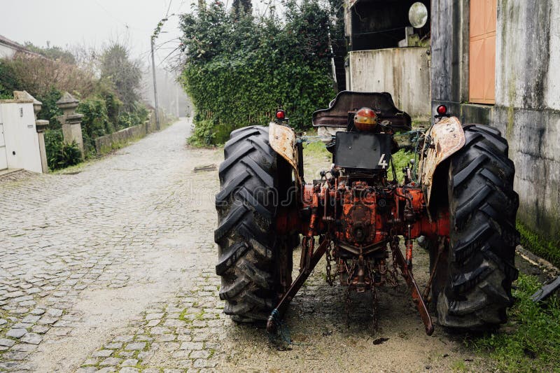 Old Classic Farm Tractor Parked in Cobblestone Street Stock Image ...