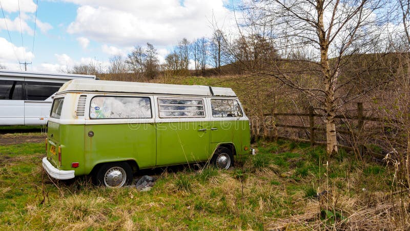 Old Classic Green Painted Camper Van with White Pop Top Left in a Field ...