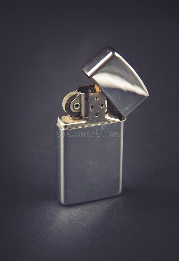 Old Vintage Lighter on a Dark Background Stock Image - Image of burn ...