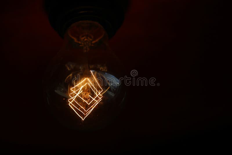 Old Clean Light Bulb Filament Glowing in the Dark Stock Image - Image ...