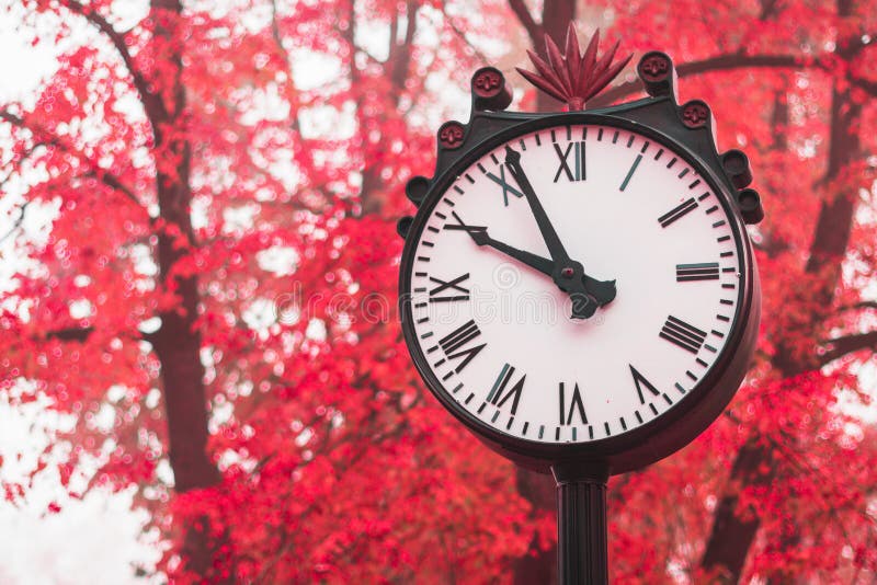 Old Clock on a Background of Red Leaves. Clock Shows the End of the ...
